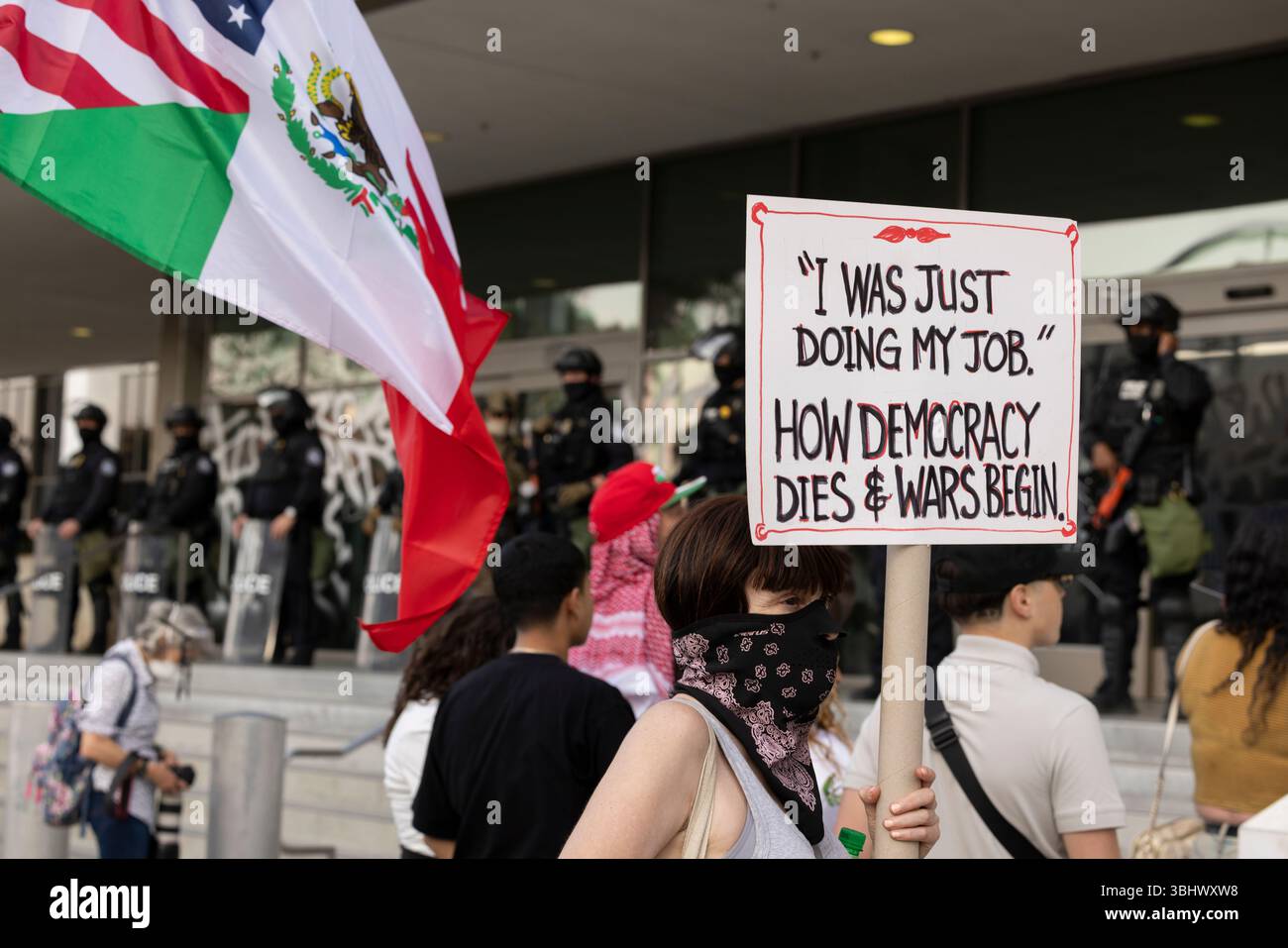Los Angeles, California, USA - June 10, 2025: People hold signs in ...