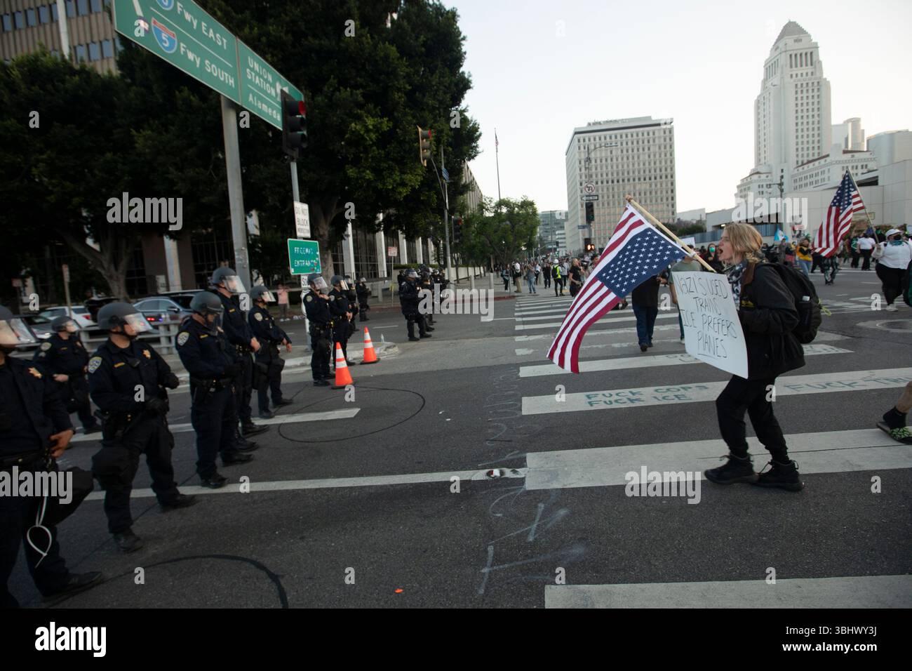 Los Angeles, California, USA - June 10, 2025: People hold signs in ...