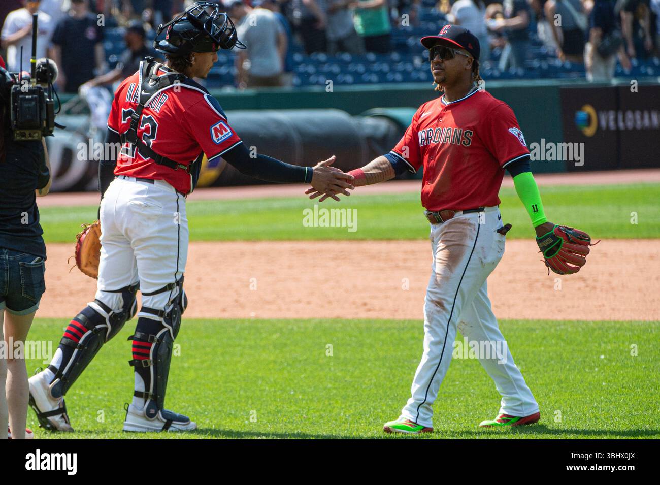 Cleveland Guardians' Bo Naylor, left, greets Jose Ramirez at the end of ...