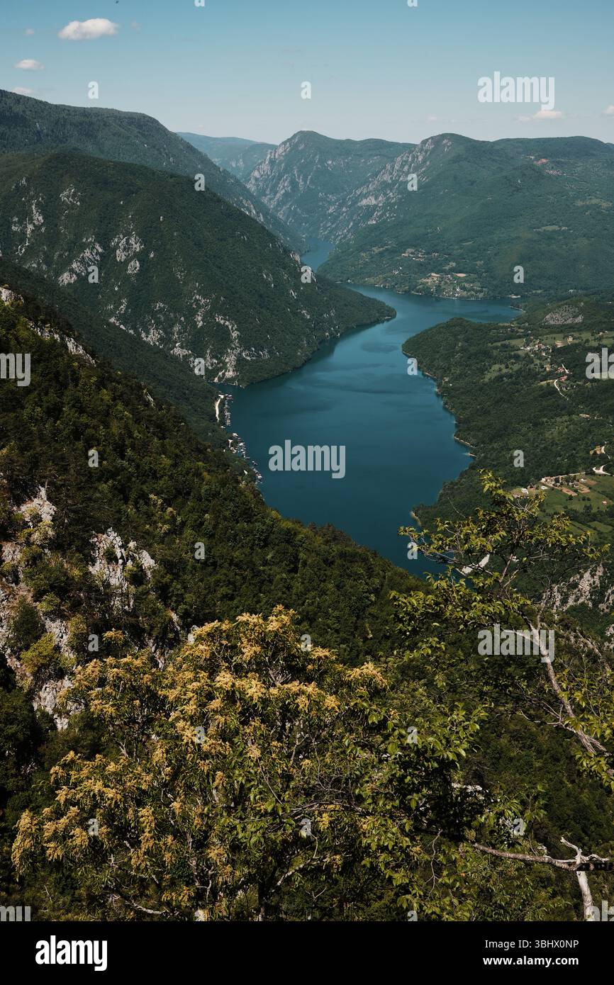 View of the winding Drina River between lush green mountains in Tara ...