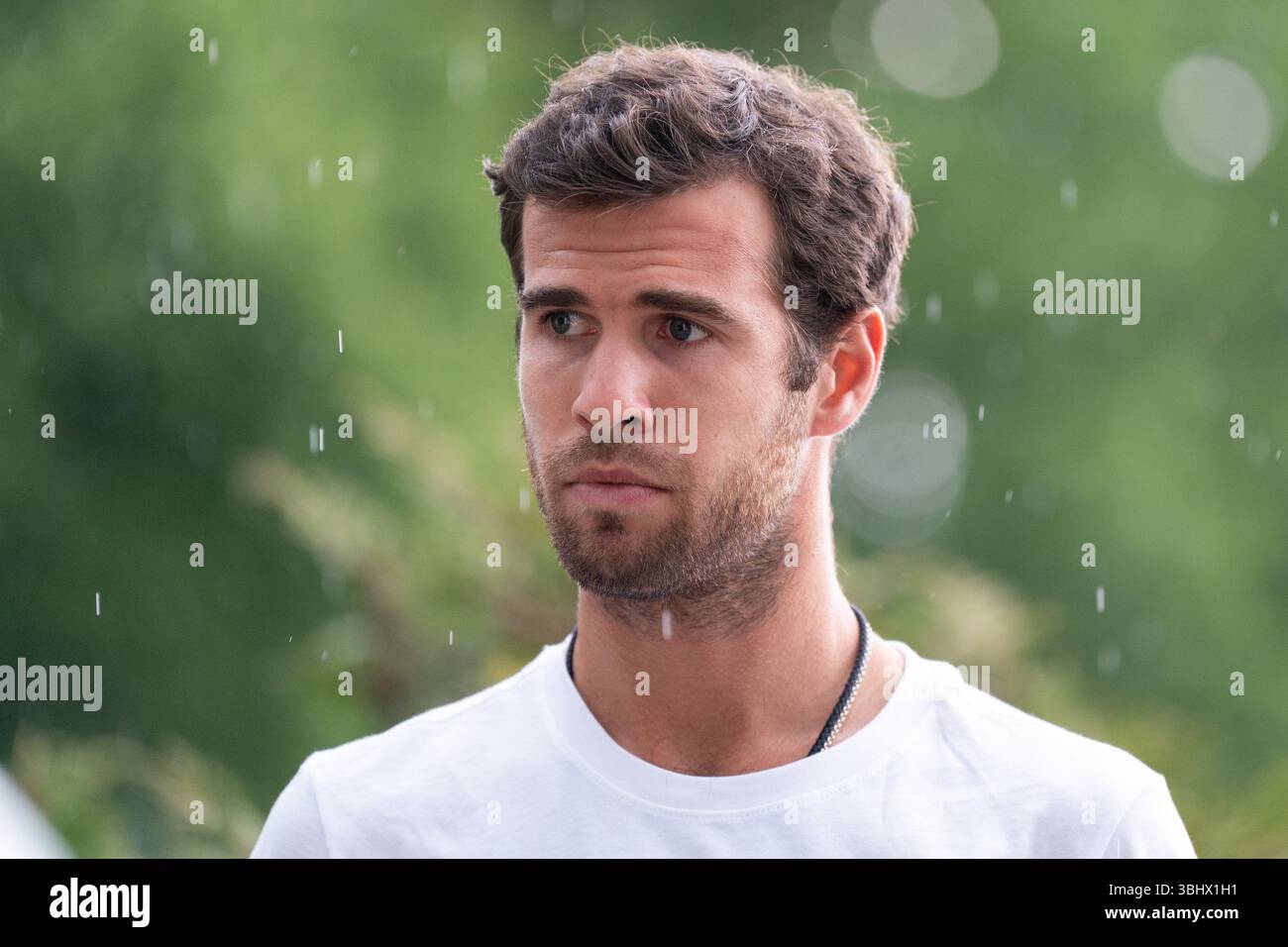 ROSMALEN, NETHERLANDS - JUNE 10: Karen Khachanov of Russia, in the rain ...