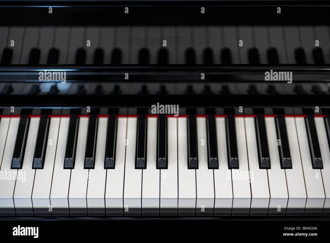 Polished black and white piano keys create a beautiful pattern, ready ...