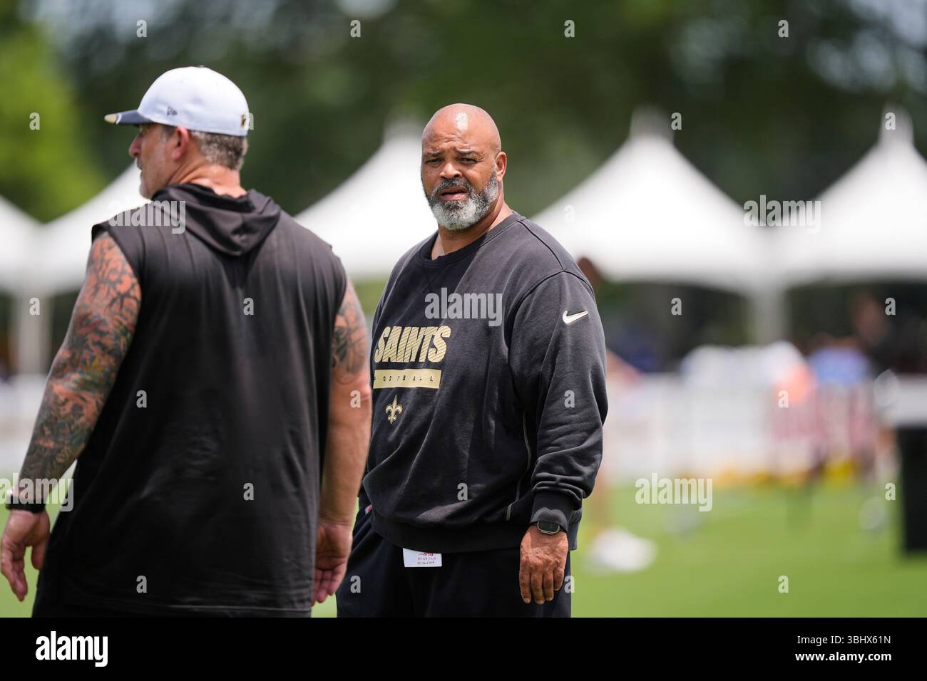 New Orleans Saints defensive line coach Bo Davis watches drills during ...