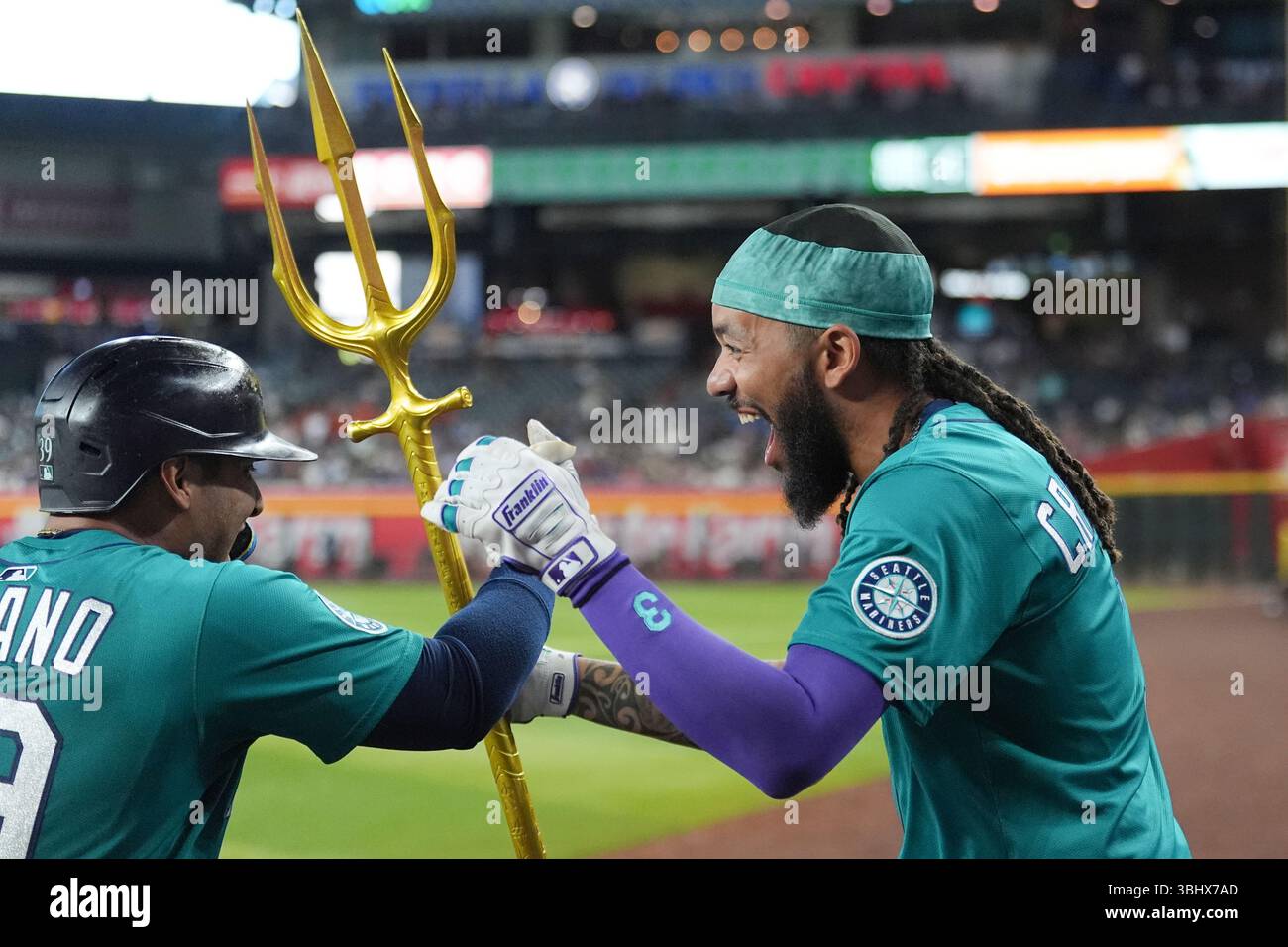 Seattle Mariners' Donovan Solano, left, celebrates his home run against ...
