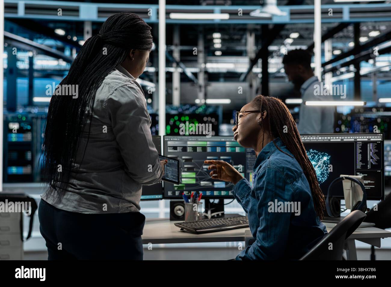 Data center team working together, using AI visualization tool to ...