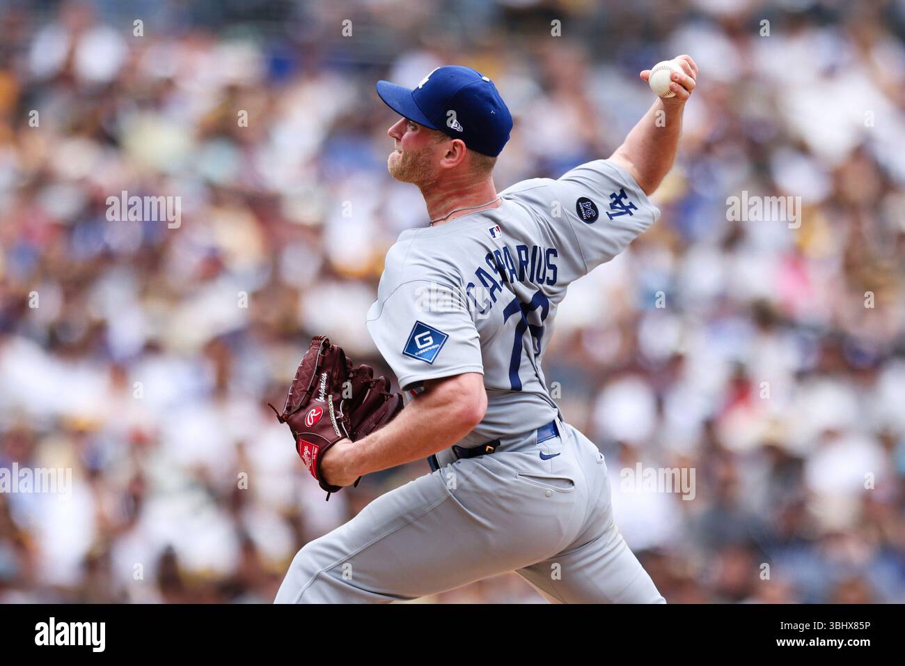 Los Angeles Dodgers' Ben Casparius winds up against a San Diego Padres ...