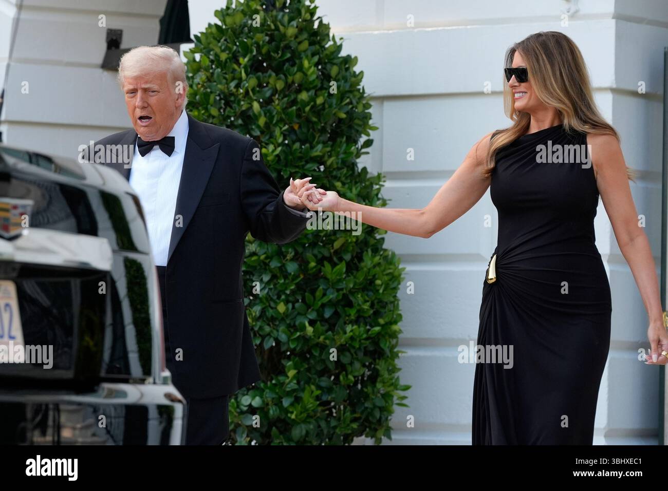 President Donald Trump and first lady Melania Trump depart the White ...