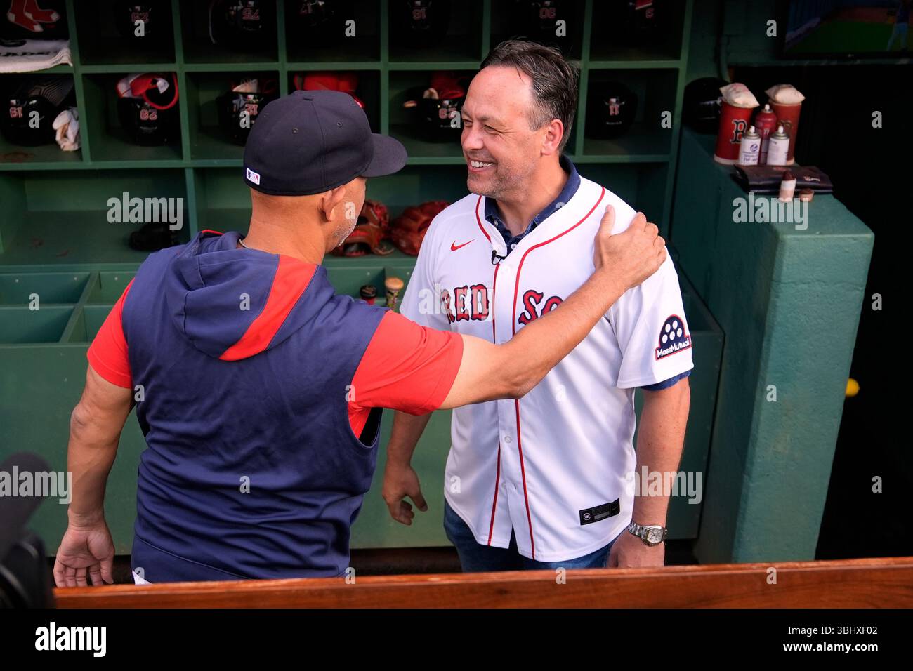 Boston Bruins manager Marco Sturm, right, chats with Boston Red Sox ...