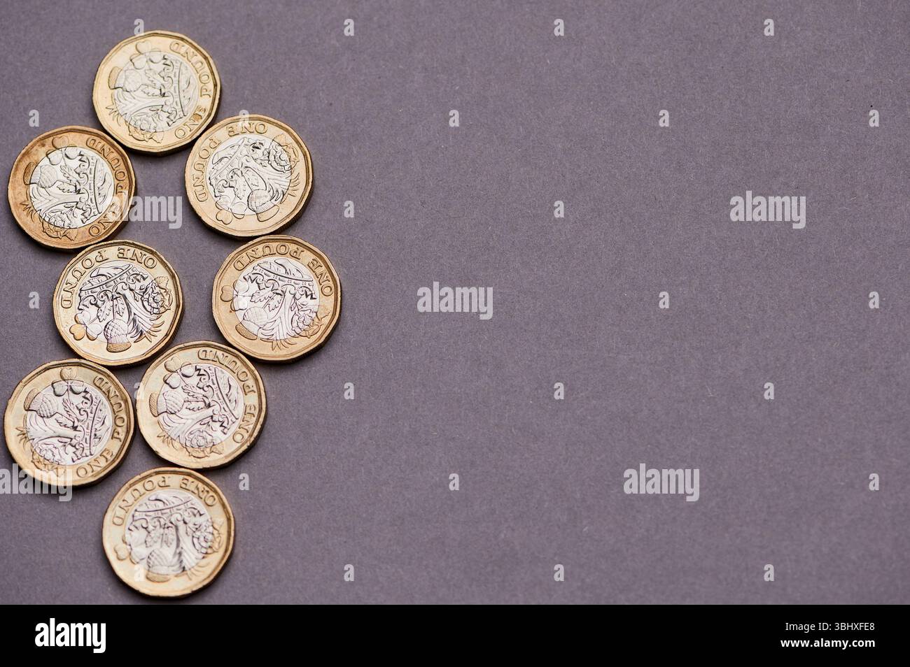 One Pound Notes Arranged Neatly On A Gray Background Stock Photo - Alamy