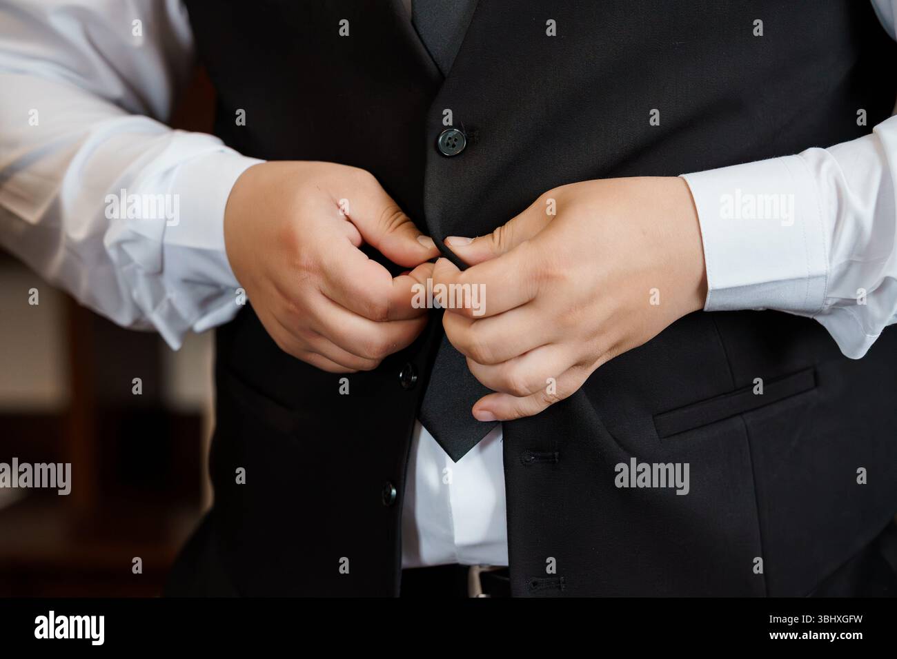 Man buttons black vest close hi-res stock photography and images - Alamy