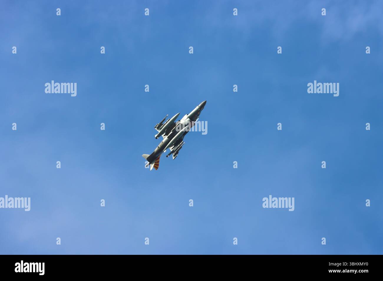 A Harrier jet making a maneuver in the air Stock Photo - Alamy