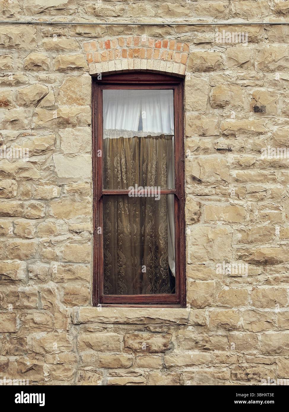 Building built 1900 with sandstone block walls, Windows have red brick ...