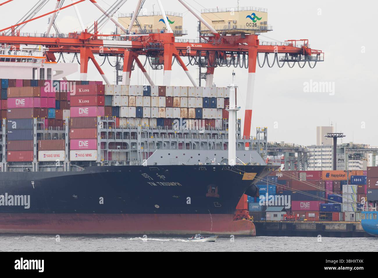 Tokyo, Japan. 14th May, 2025. A loaded container ship inside Tokyo ...