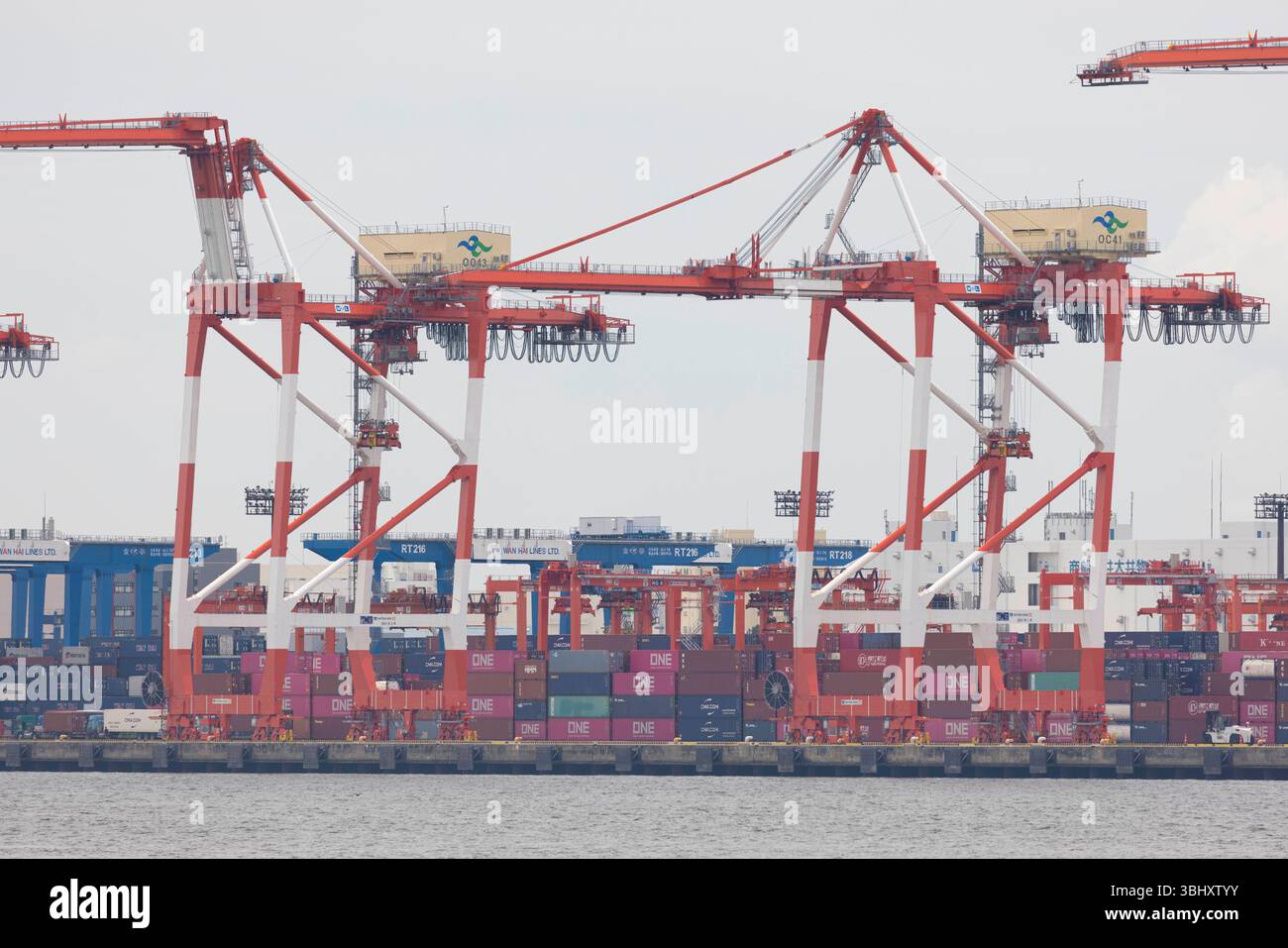 Tokyo, Japan. 14th May, 2025. Cranes and shipping containers in Tokyo ...