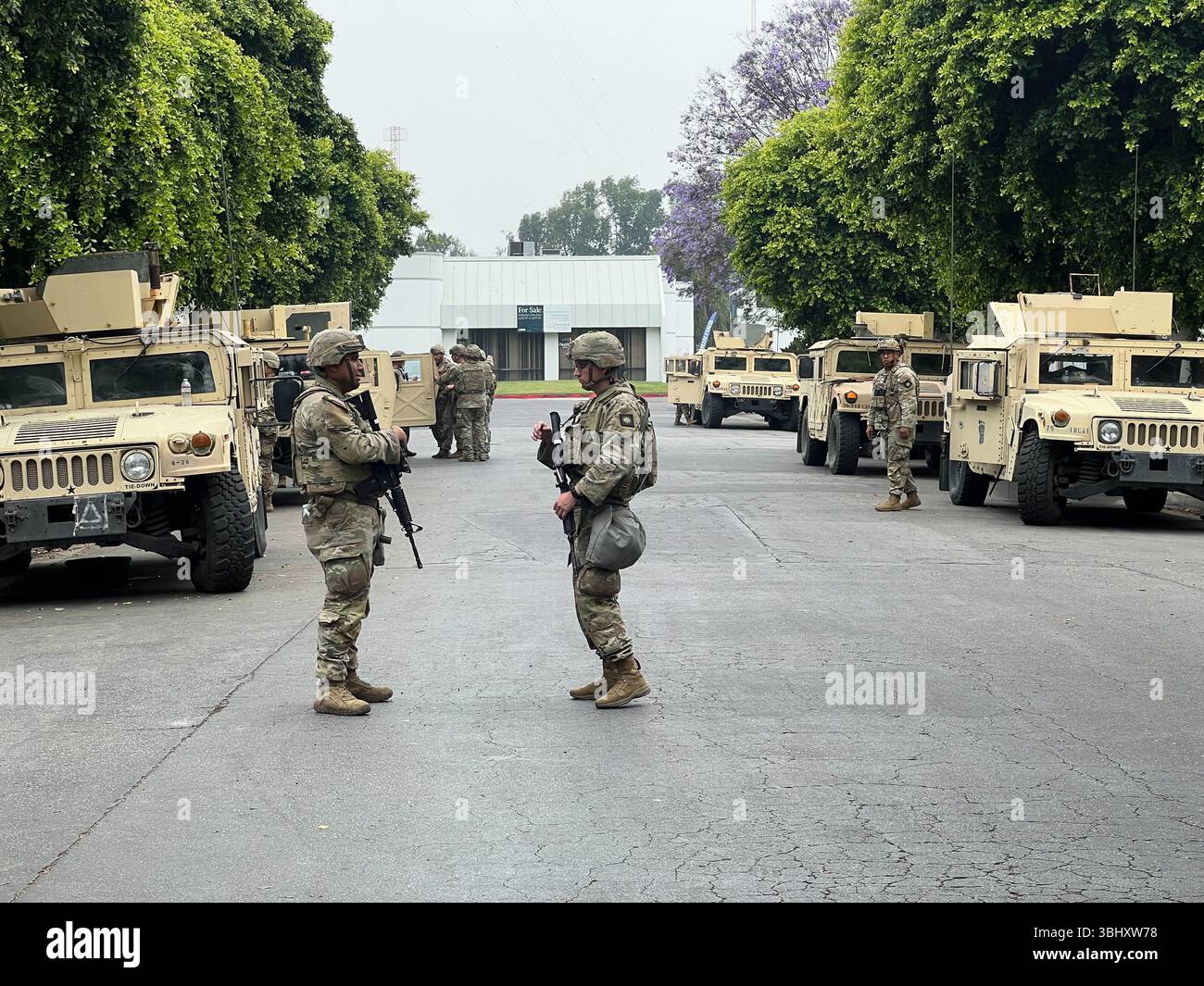Paramount, USA. 11th June, 2025. National Guard soldiers guard the ...