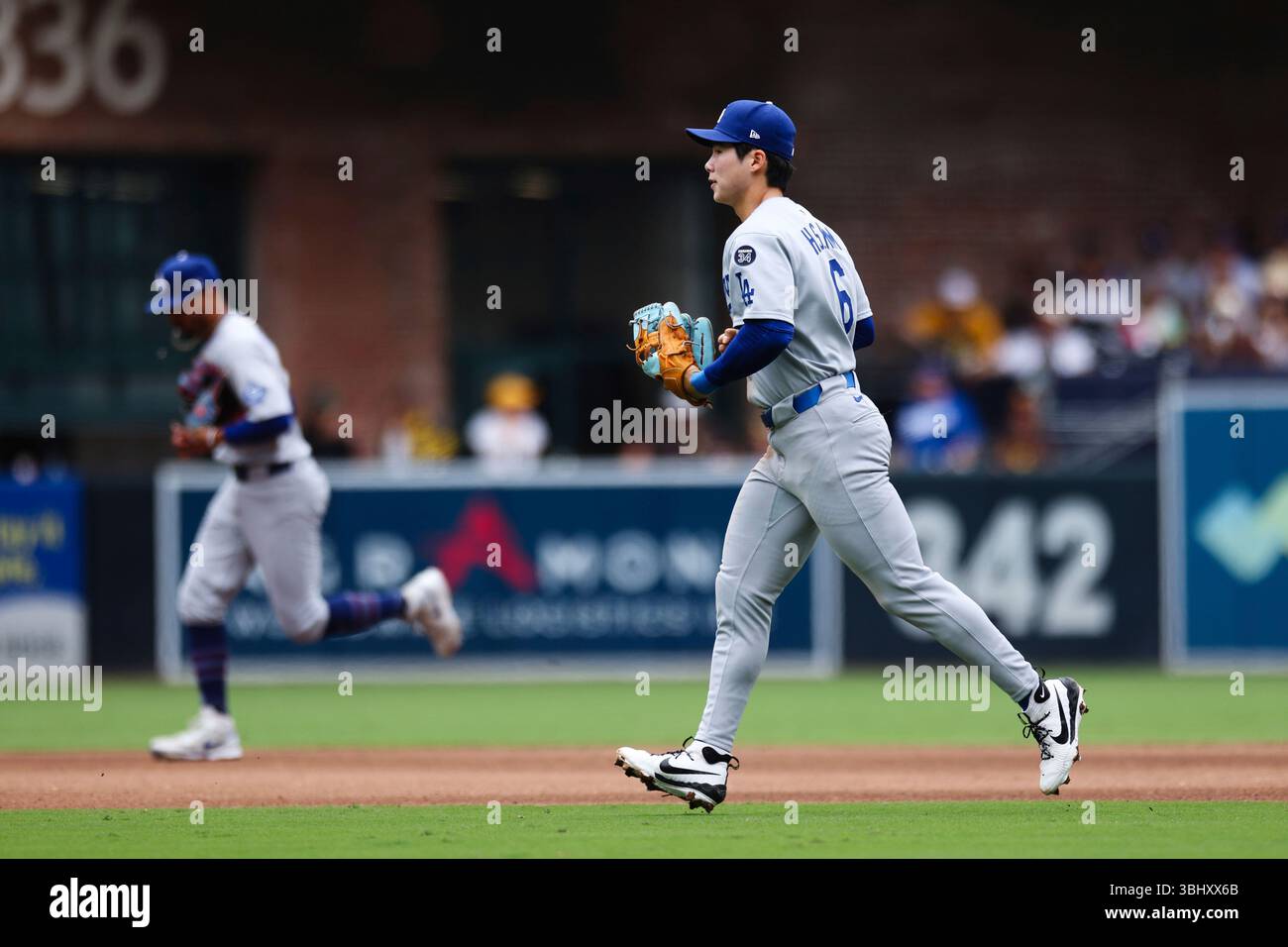 Los Angeles Dodgers' Hyeseong Kim runs off the field during a baseball ...