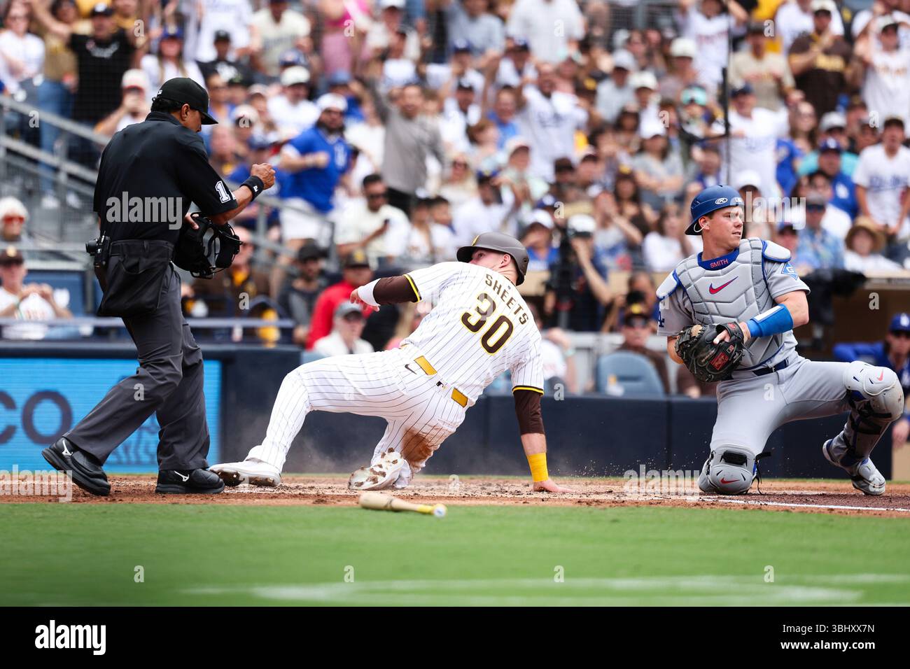 San Diego Padres' Gavin Sheets, center, is called out by umpire Erich ...