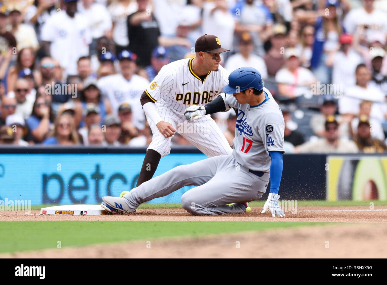 Los Angeles Dodgers' Shohei Ohtani, foreground, slides safely into ...