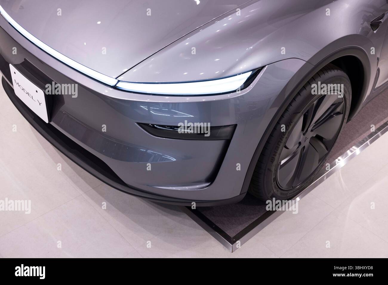 Tokyo, Japan. 25th Apr, 2025. Tesla model Y on display inside a Tesla ...
