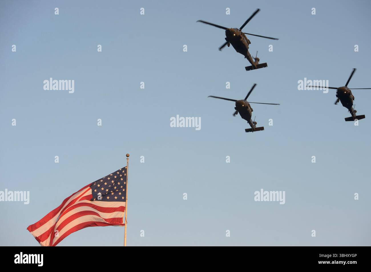 U.S. Army Blackhawk helicopters pass overhead for a flyover during the ...