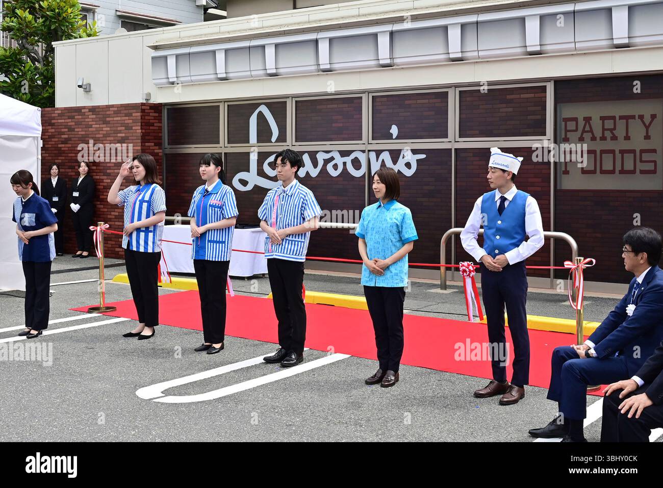 Convenience store chain Lawson's past uniforms are on display in front ...