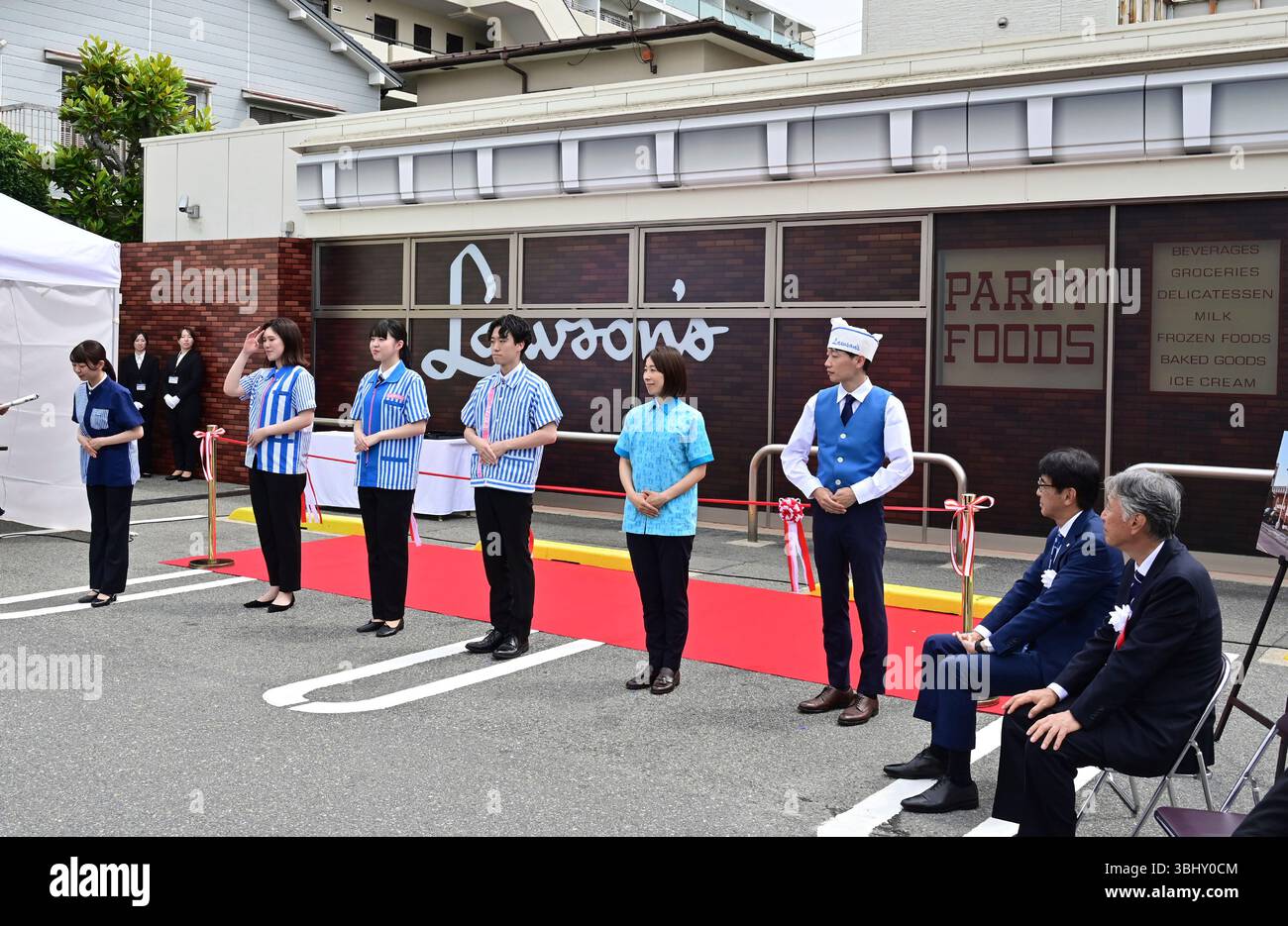 Convenience store chain Lawson's past uniforms are on display in front ...