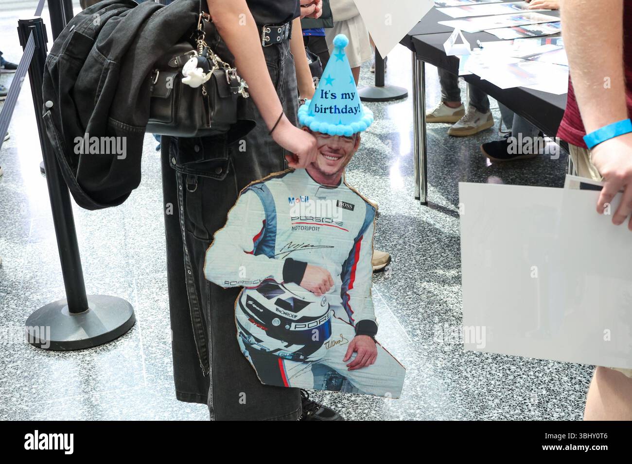 May 31st, 2025: A fan holds a cardboard cutout during the autograph ...