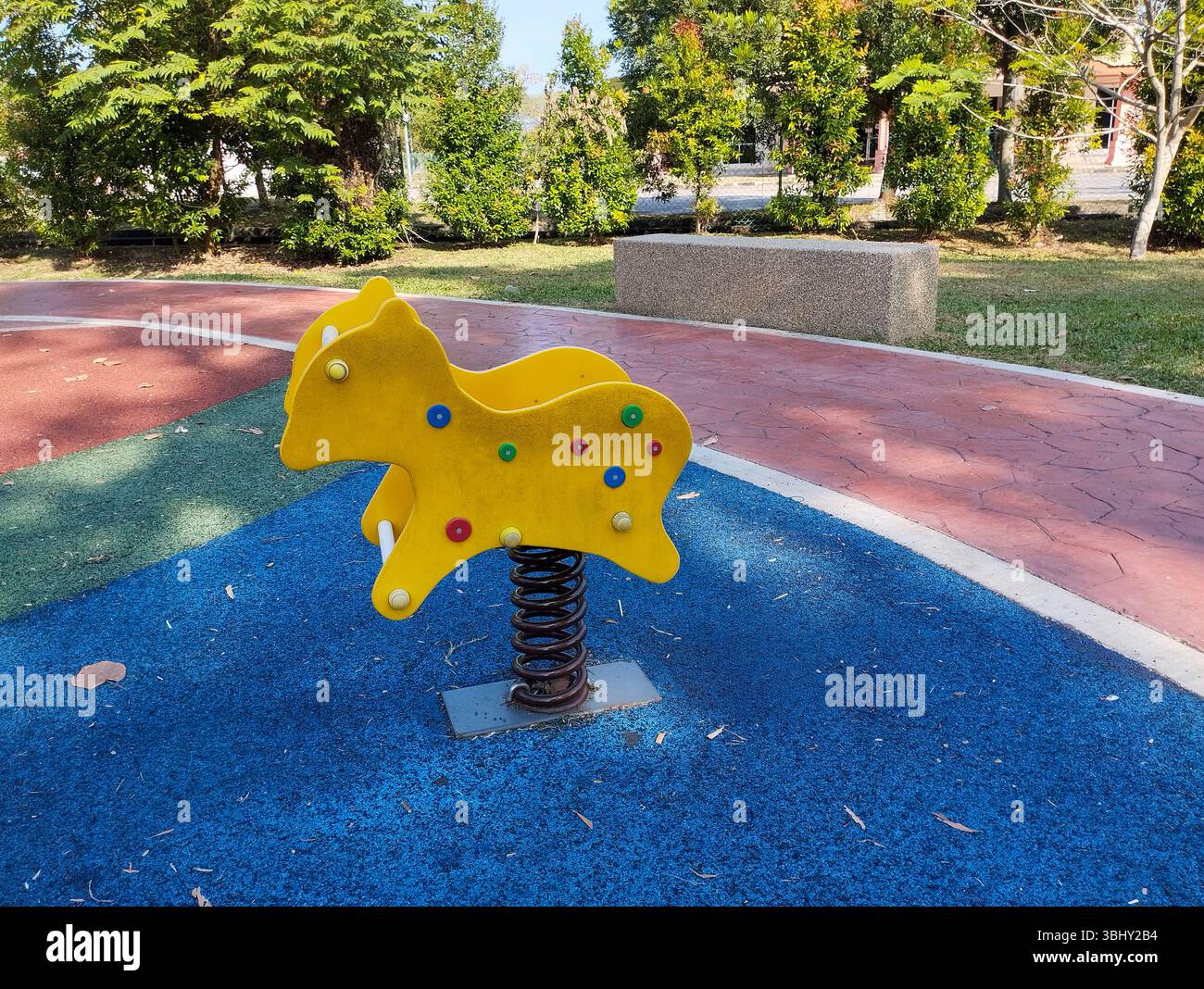 Colorful Spring Rider Horse in a Playground with Rubber Flooring and ...