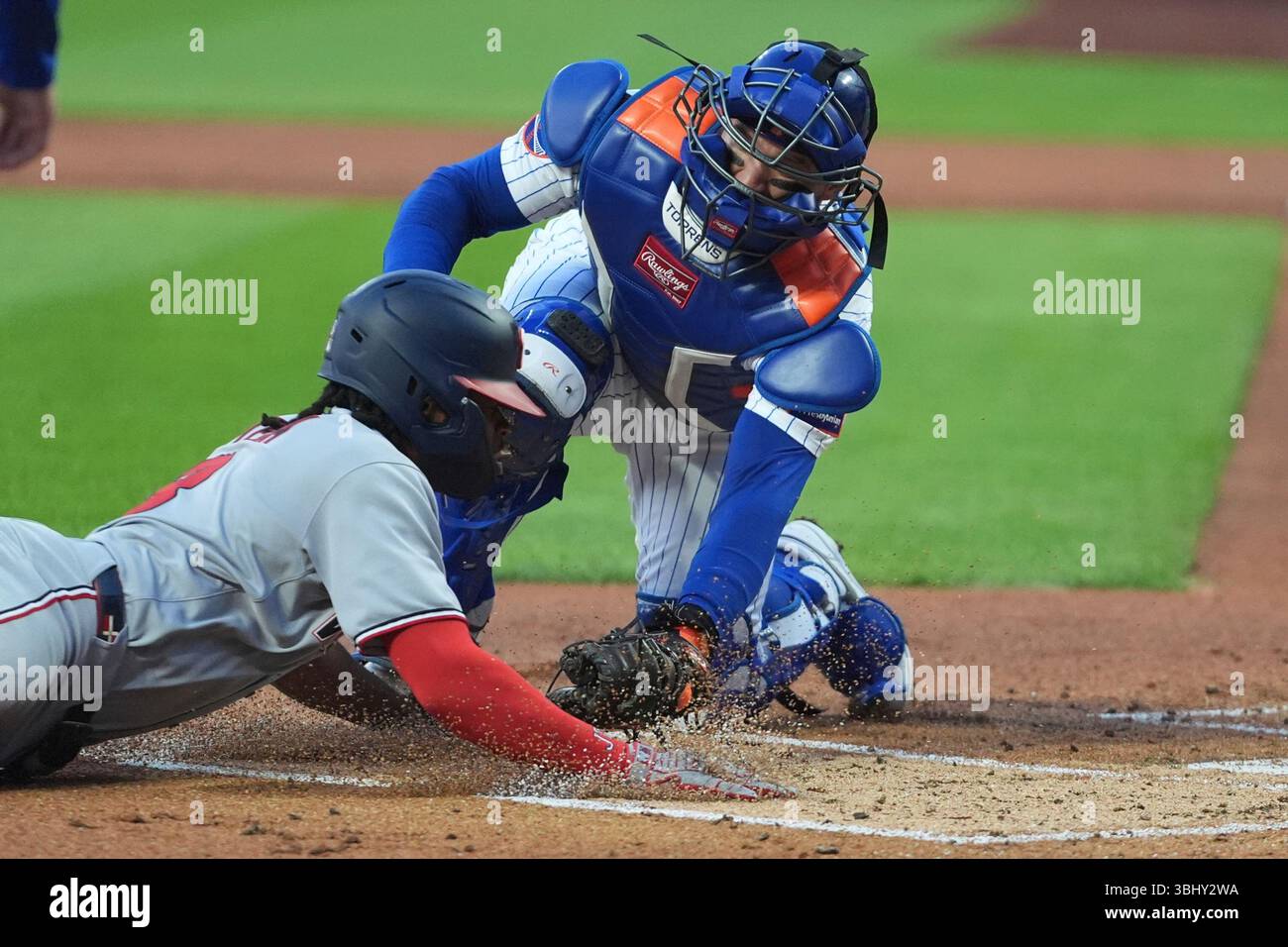 New York Mets catcher Luis Torrens, right, tags out Washington ...