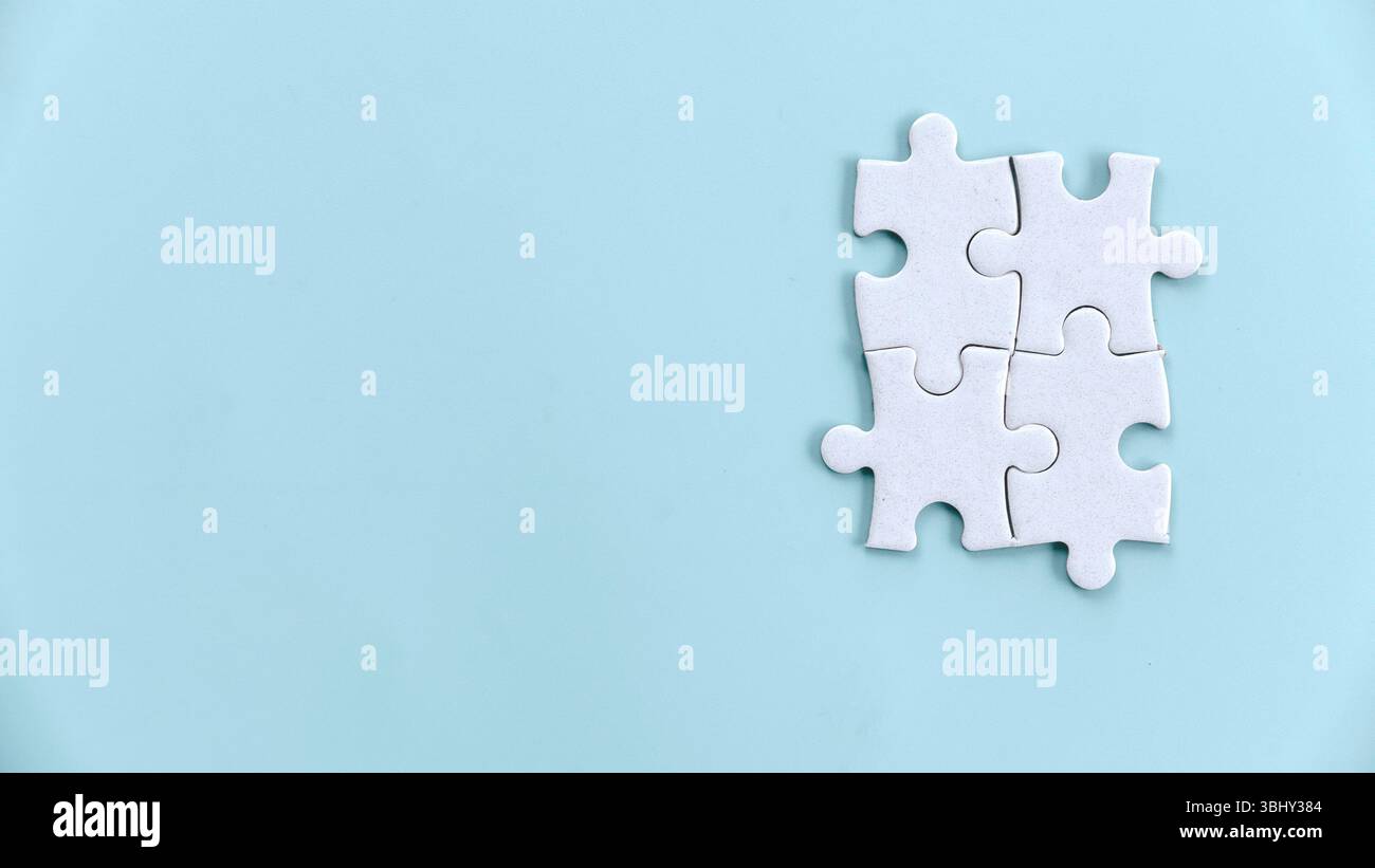 Four Jigsaw Puzzle Pieces Interlocking: Symbolizing Teamwork and ...