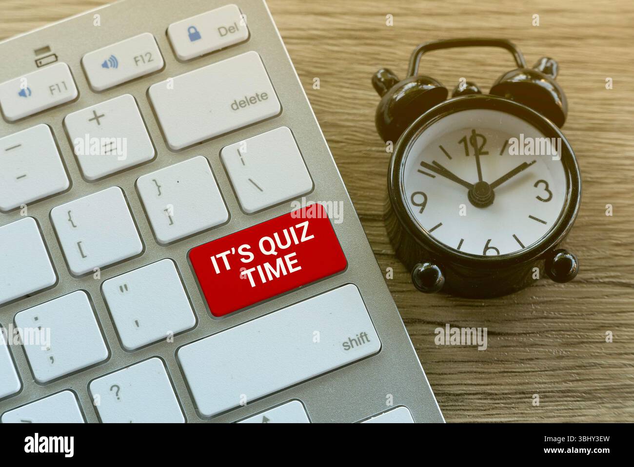 Quiz Time Concept with Keyboard and Alarm Clock Stock Photo - Alamy
