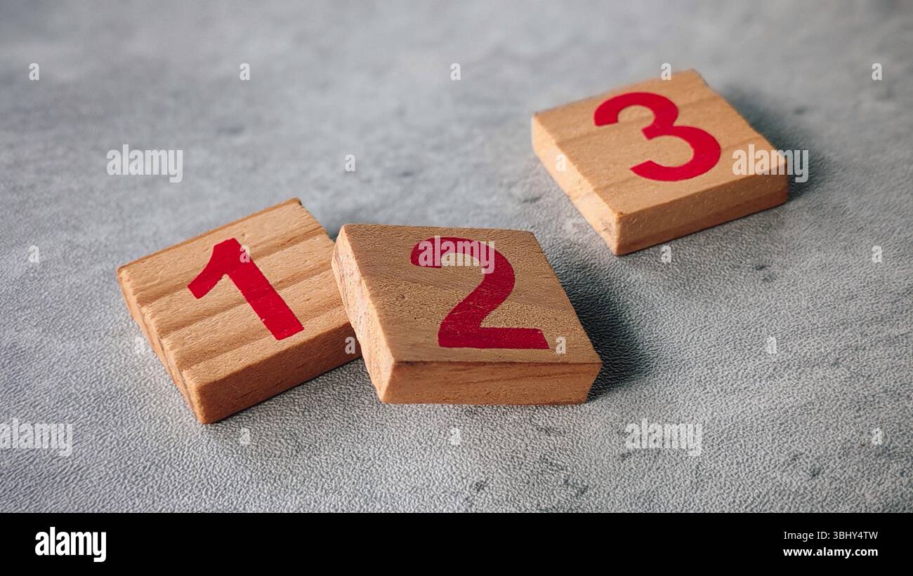 Wooden Number Blocks 1, 2, 3 Arranged on Gray Surface Stock Photo - Alamy