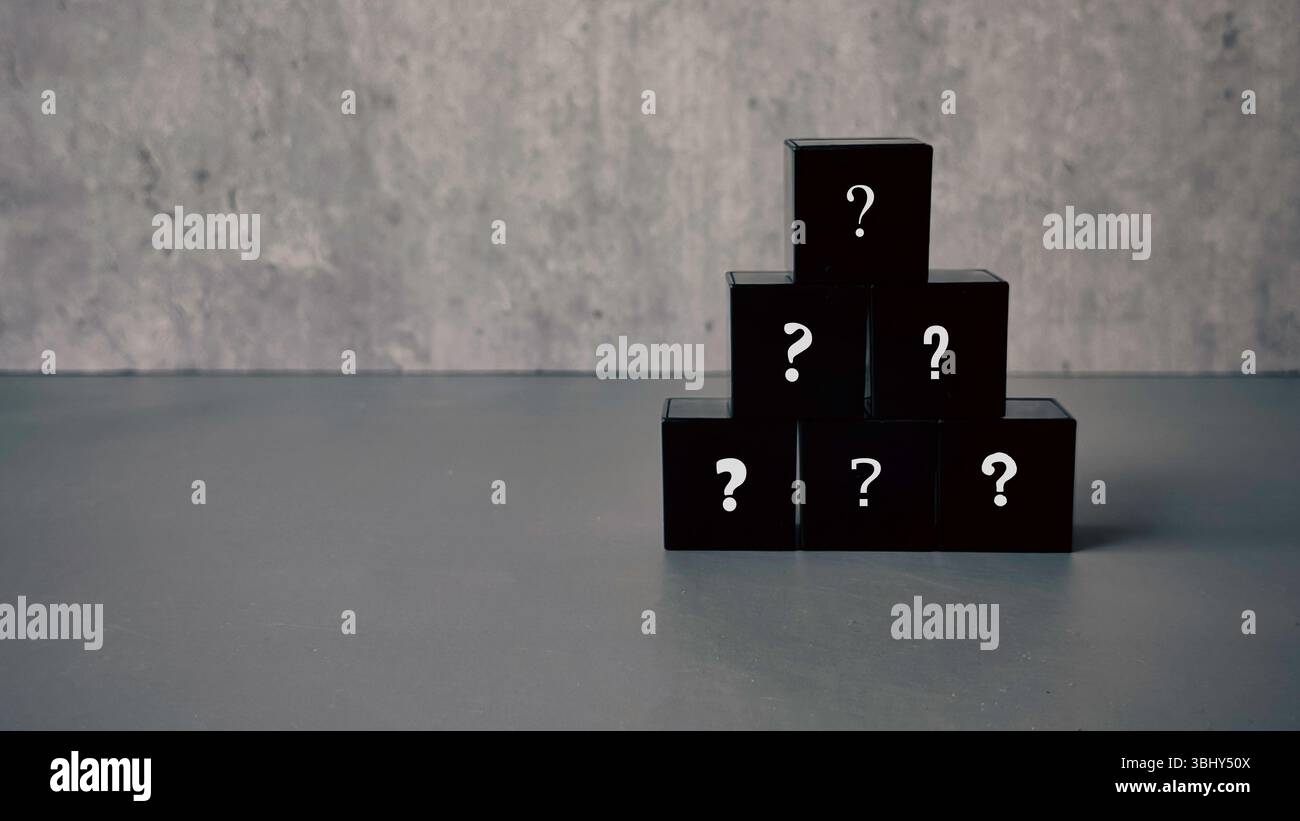 Question and answer concept. Stack of black cube with a symbol of ...