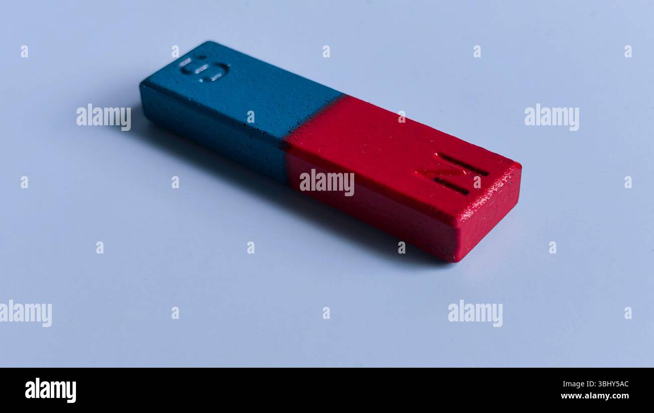 Blue and Red Magnet with North and South Pole Signs on Blue Background ...