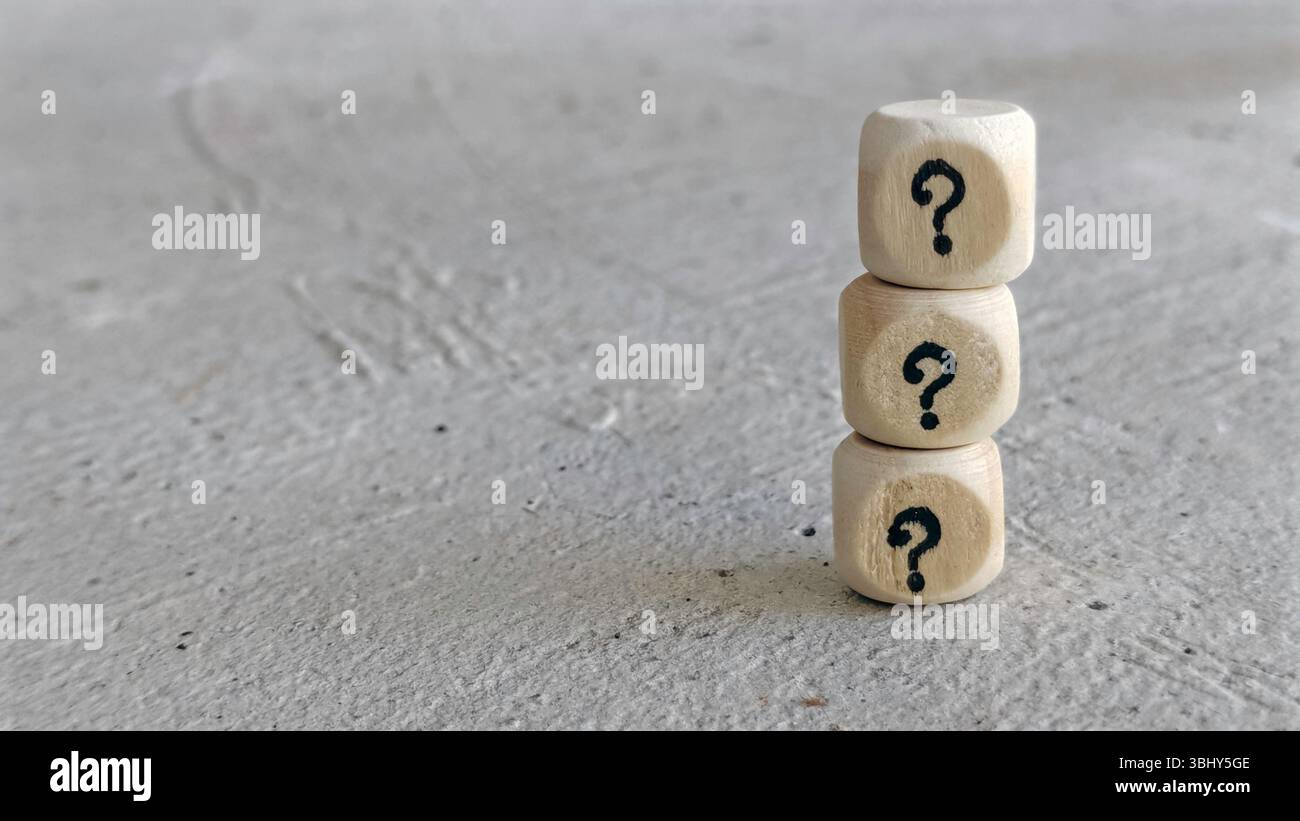 Three Wooden Dice with Question Marks Stock Photo - Alamy