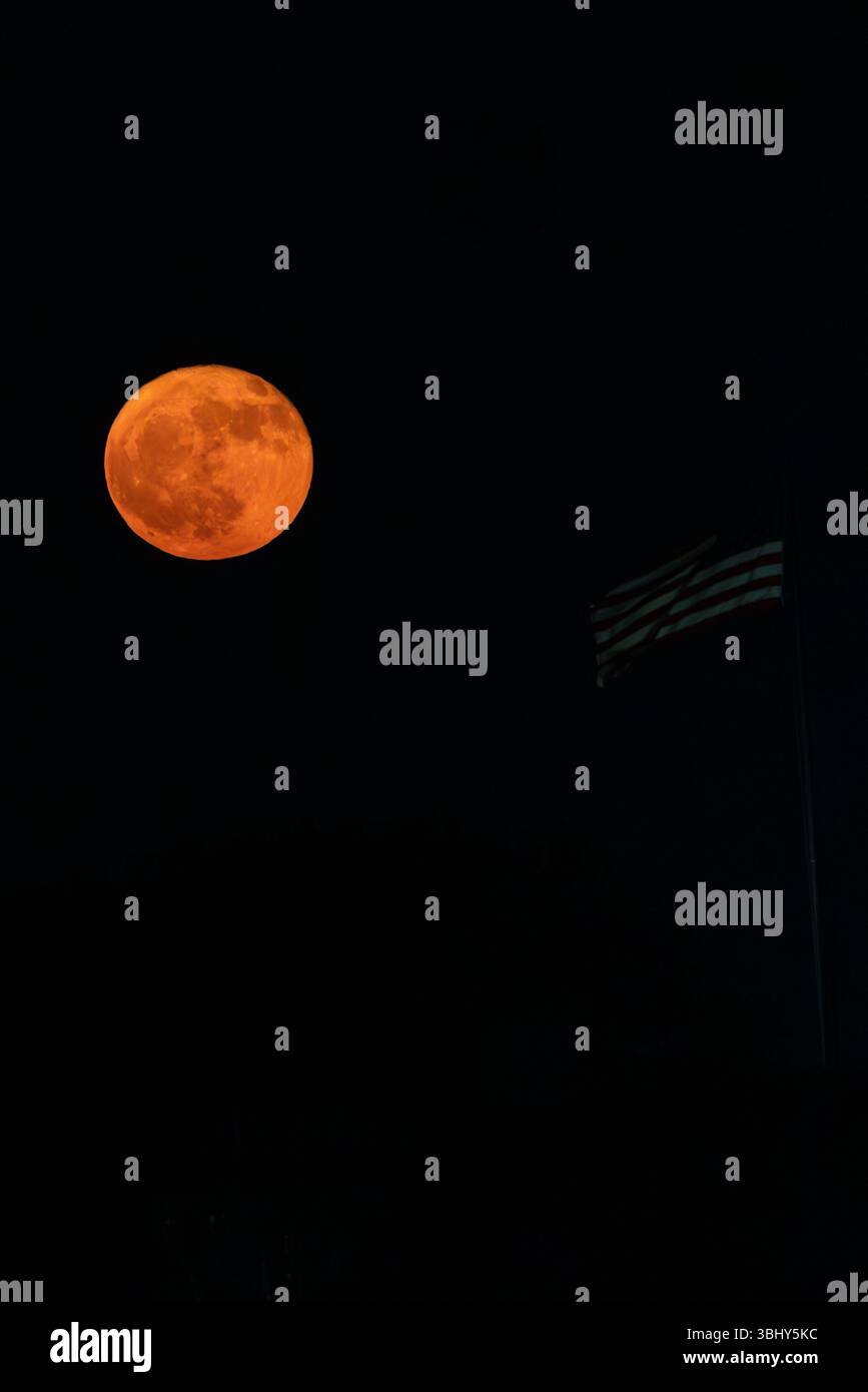 The so-called strawberry moon rises over Statue of Liberty in New York ...