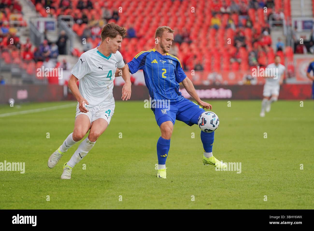 Oleksandr Martyniuk #2 of Ukraine and Tyler Bindon #4 of New Zealand ...