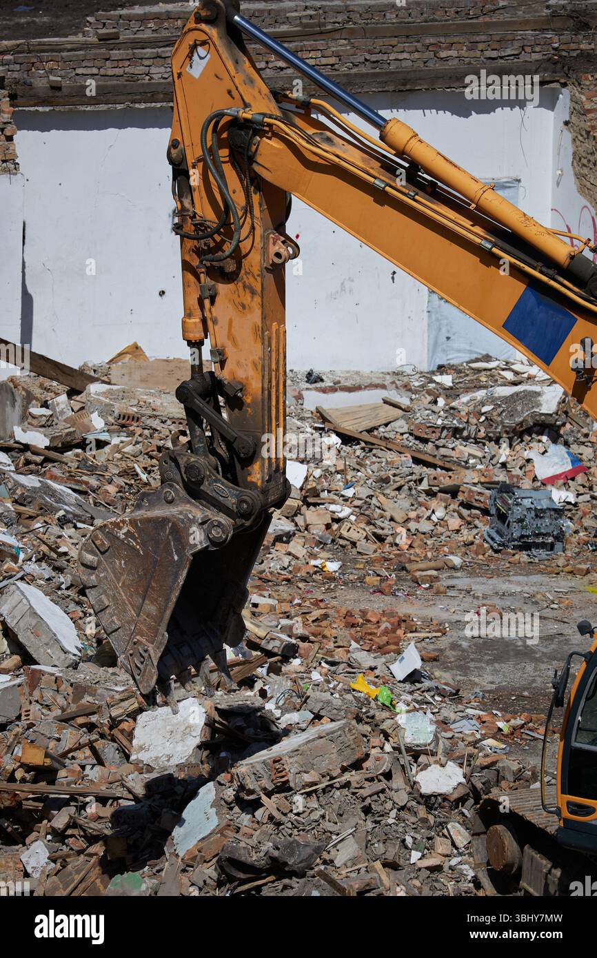 excavator bucket on dismantling site, side view Stock Photo - Alamy