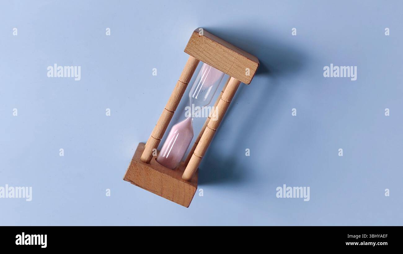 Sand Clock on Blue Background Representing Time, Patience, and the ...