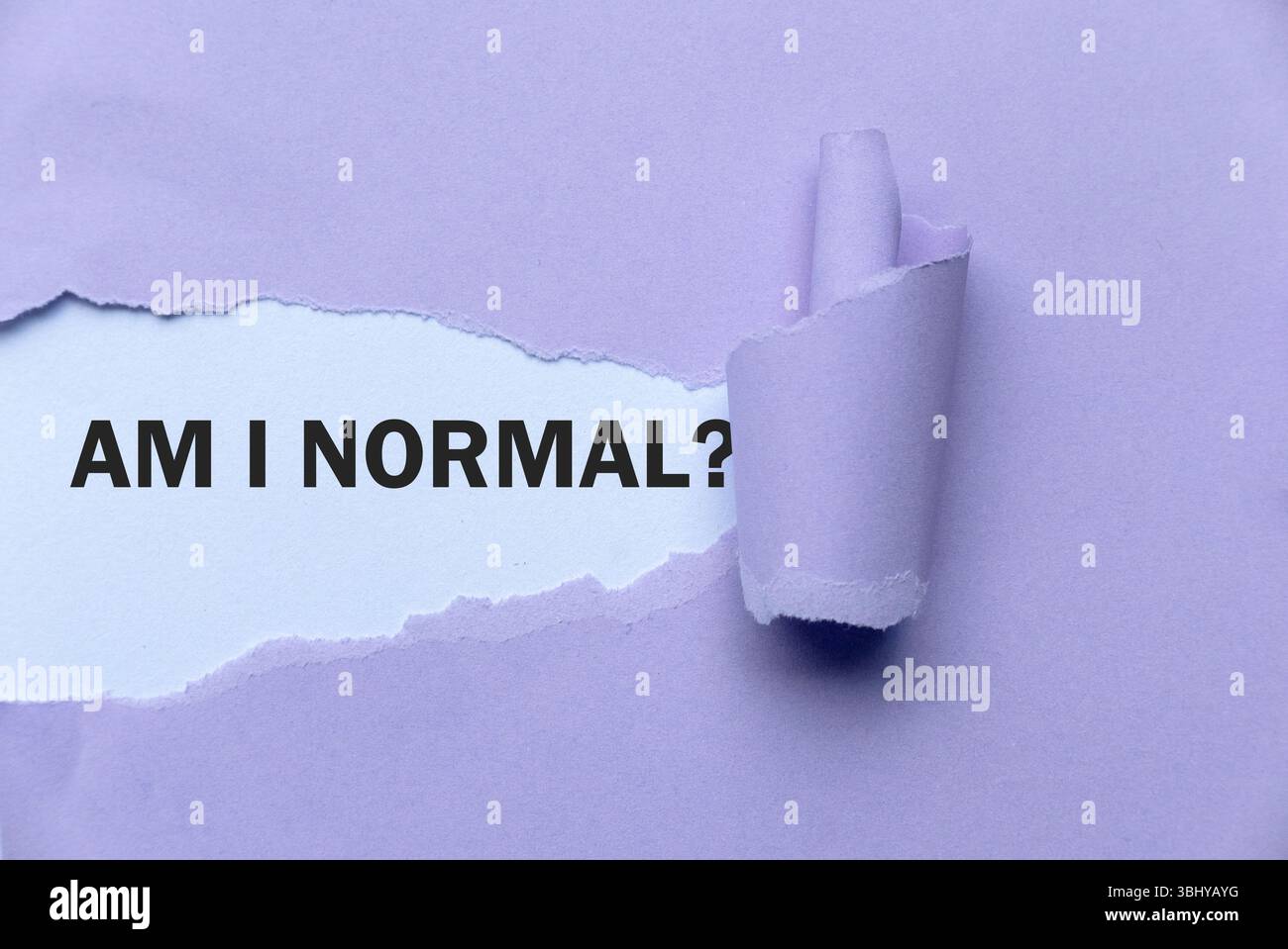 Purple Torn Paper Revealing the Word 'Am i normal?' Stock Photo - Alamy