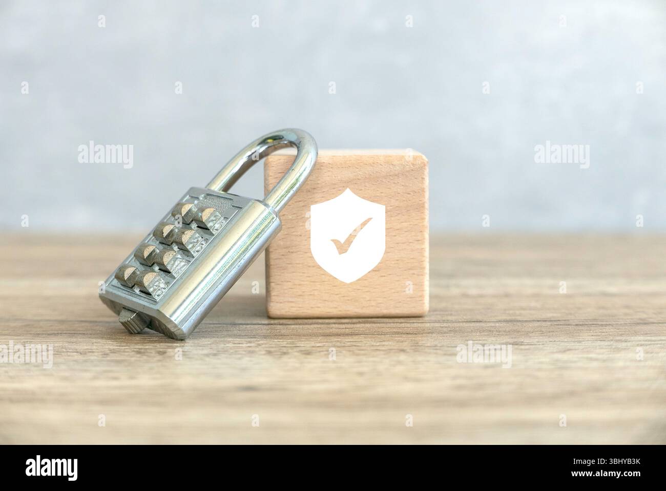 Security Concept: Metal Padlock and Wooden Block with Shield and ...