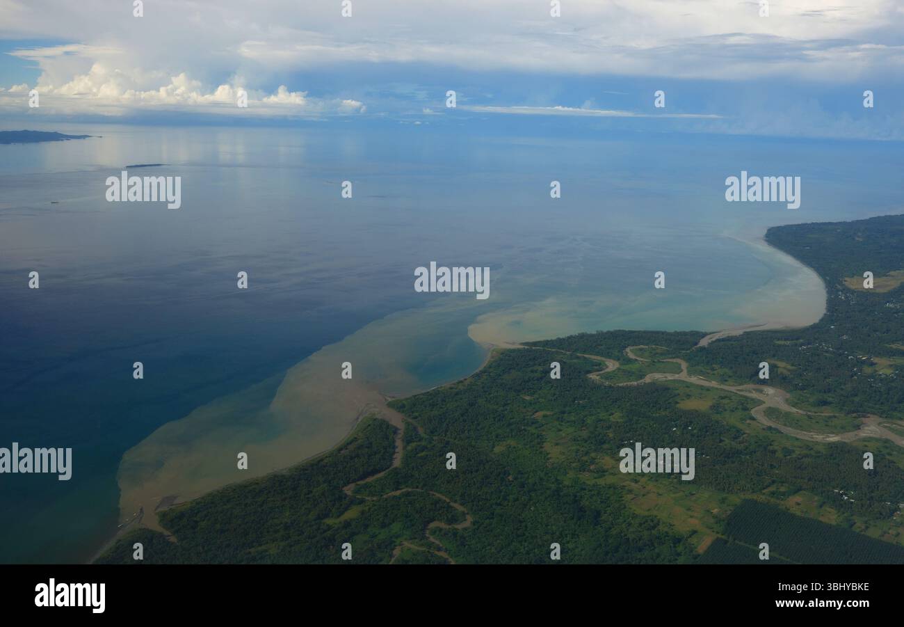 Aerial view of rivers pouring polluting sediment into the lagoon ...