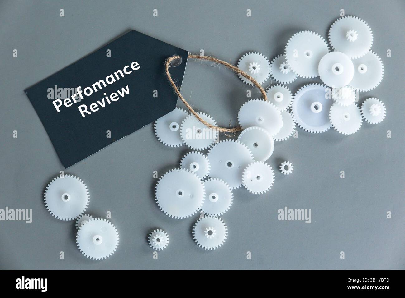 Performance Review Concept with Gears and Tag on Gray Background Stock ...