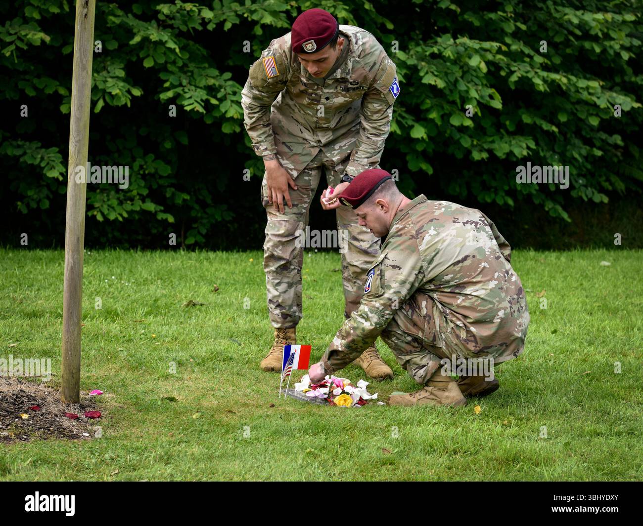 U.S. Army paratroopers assigned to 173rd Airborne Brigade pay their respects at the C-47 ...