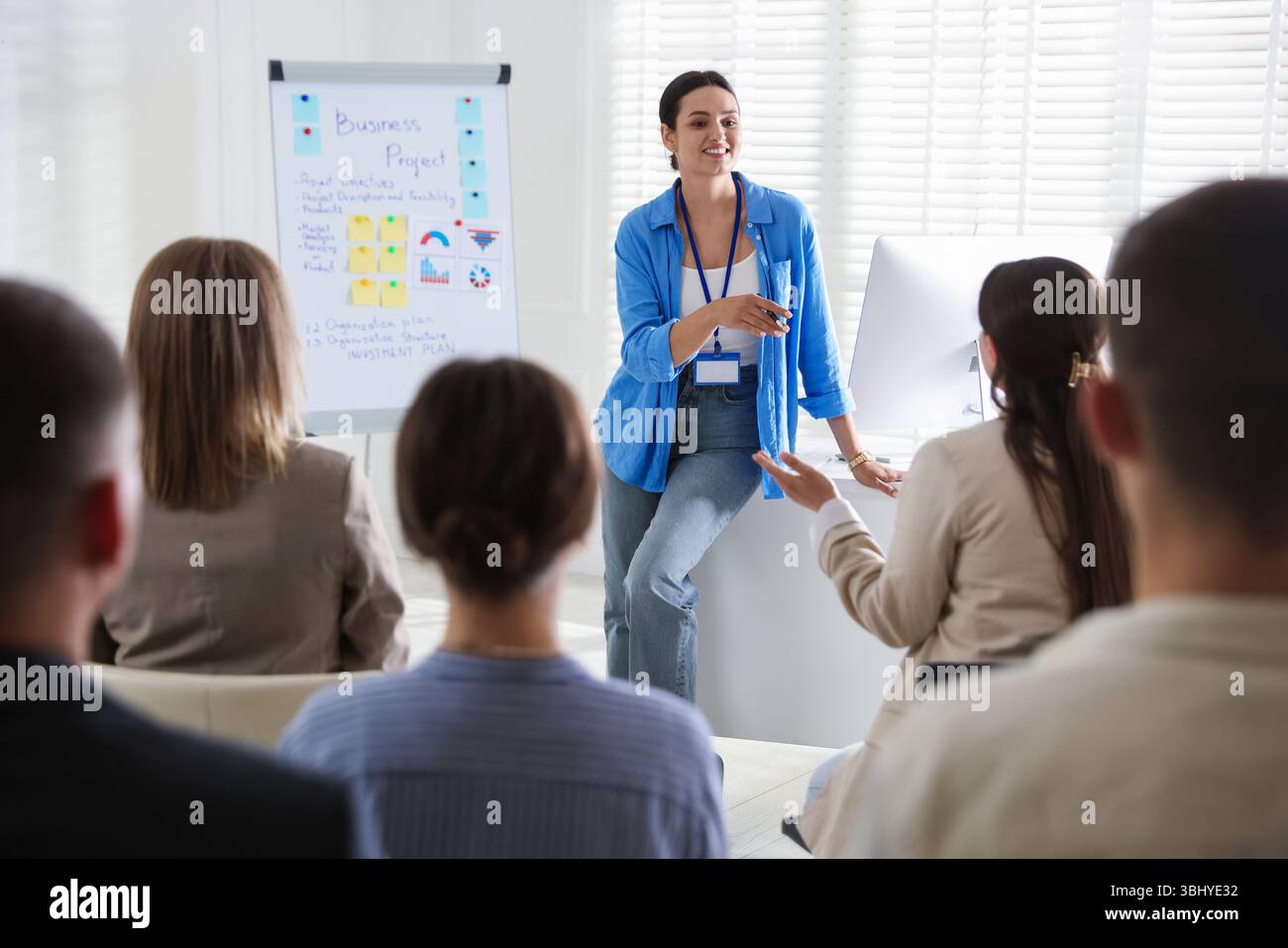 Woman giving speech in front hi-res stock photography and images - Alamy