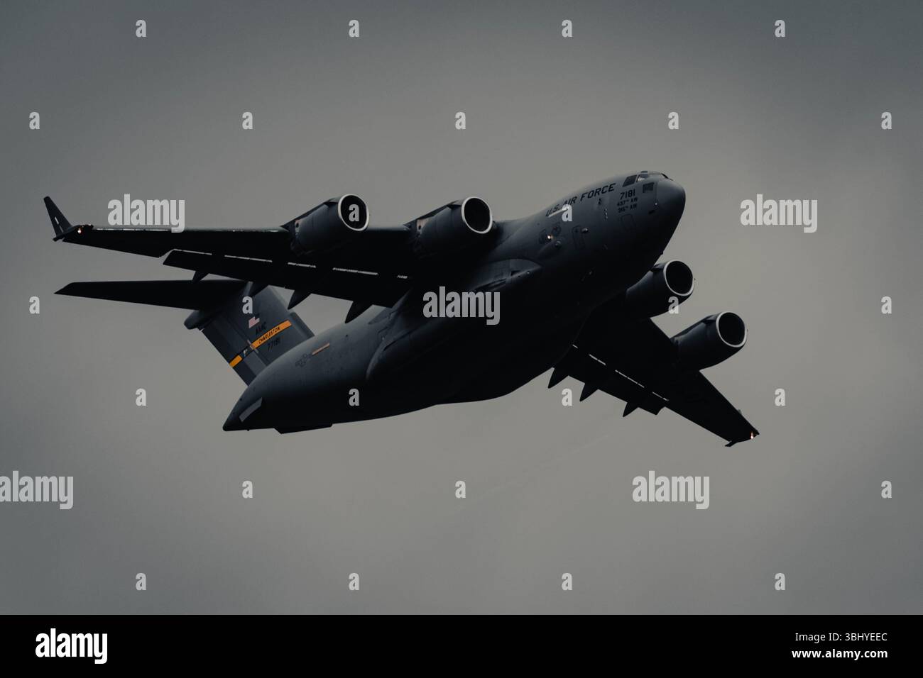 A C-17 flies over Pike Field during the Army 250 celebration at Fort ...