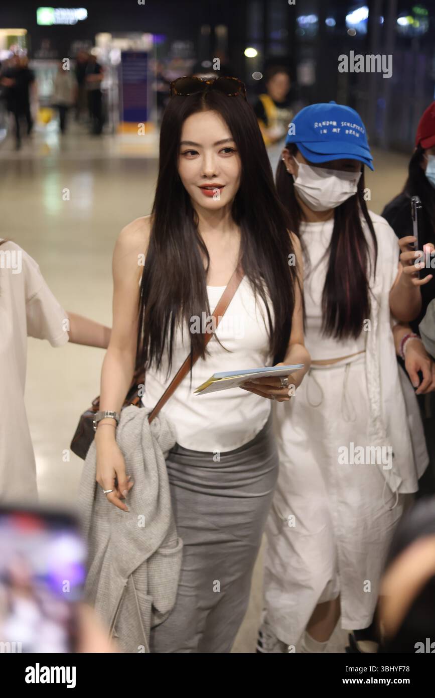 Chinese actress Cai Wenjing appears at the airport in Shanghai, China, 11 June, 2025 Stock Photo ...