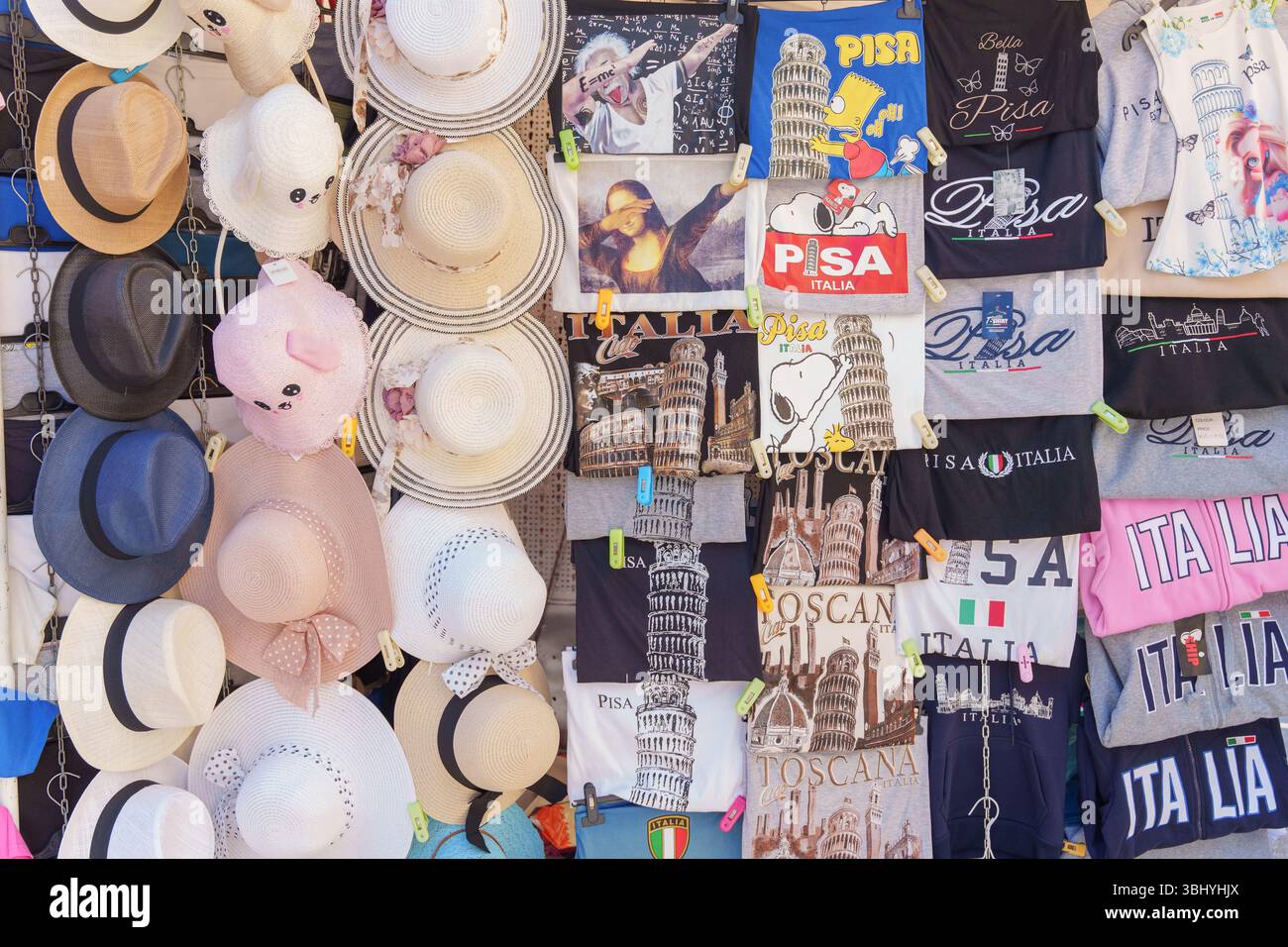 Souvenir shop in Pisa, Italy with hats and t-shirts featuring the ...