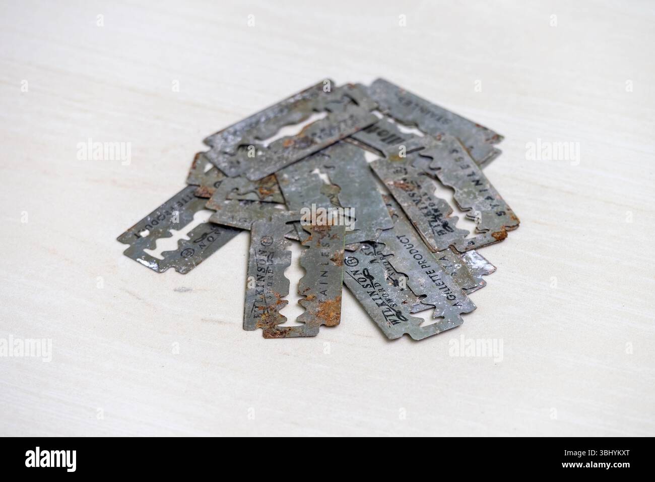 Old, rusty razor blades on a light wooden surface Stock Photo - Alamy