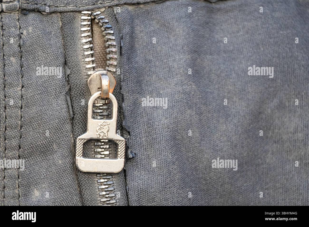 Close-up of an open zipper on a woman's handbag. Black bag texture ...